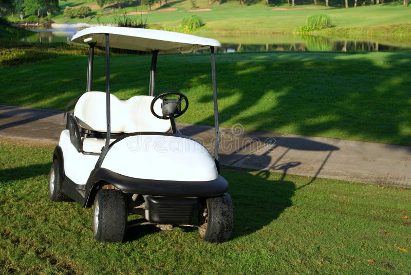 White Golf Cart Parked on the Golf Course with Morning Sunlight Stock ...
