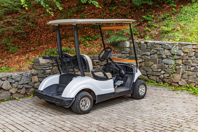 A White Golf Cart is Parked Stock Image - Image of lifestyle ...