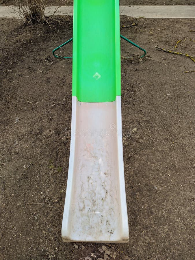 White and Green Plastic Slide on the Playground in the Daytime in ...