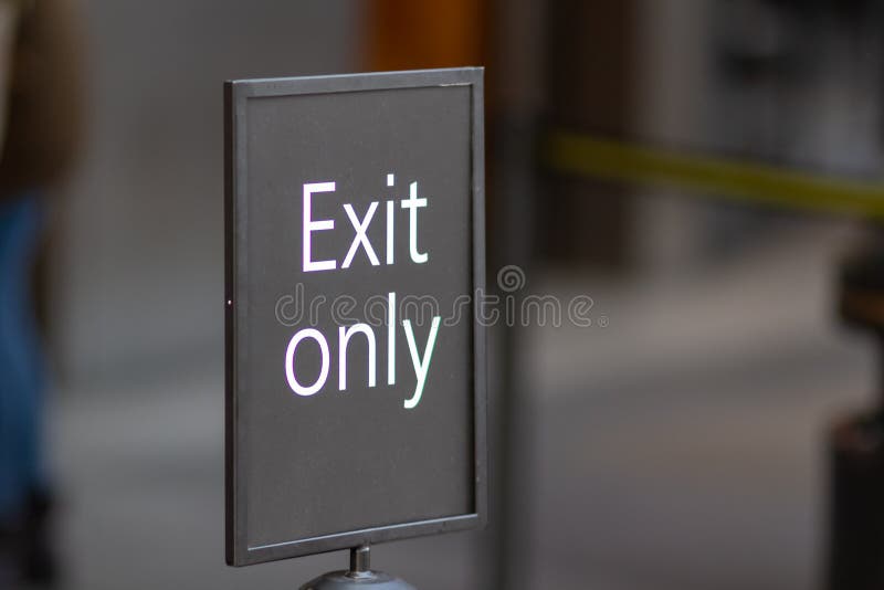 White on Grey Exit only Sign Shallow Depth of Field Stock Image - Image ...