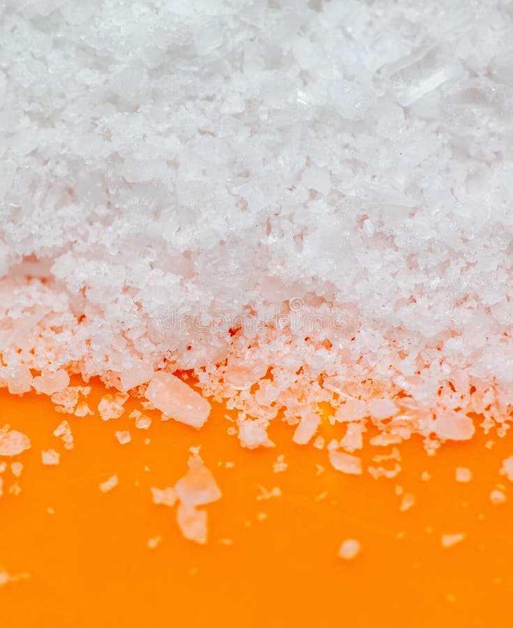 White Ground Salt on an Orange Background. Stock Image - Image of ...