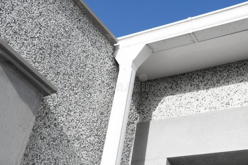 White Gutter on the Rooftop of House Wall Rain Metal. White Plastic ...