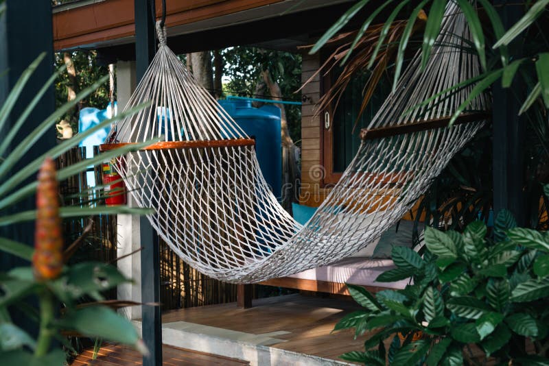 White Hammock Made of Netting Hanging in Front of Tropical Resort ...