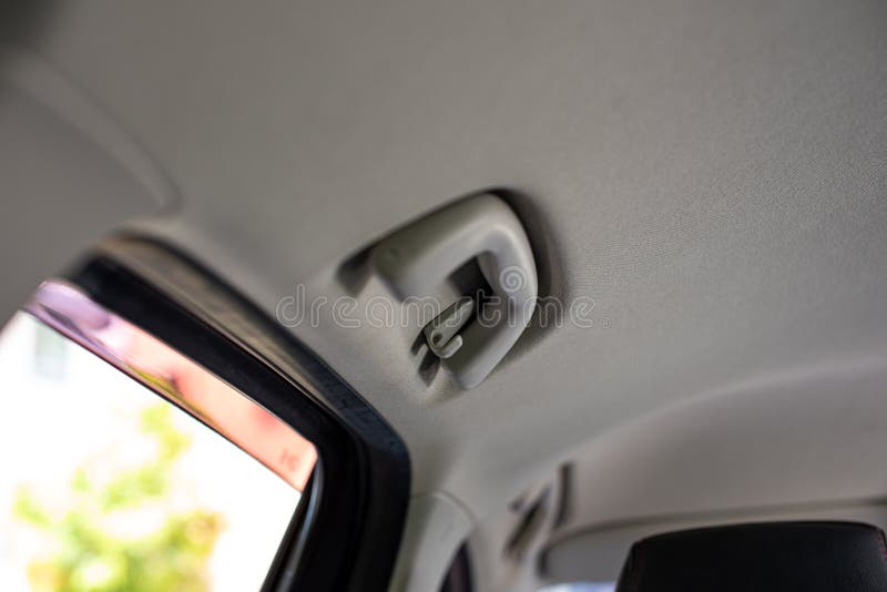 White Hand Grip from the Back Seat Stock Photo - Image of hold ...