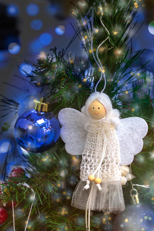 White Hand-made Angel Decorates Christmas Tree Stock Photo - Image of ...