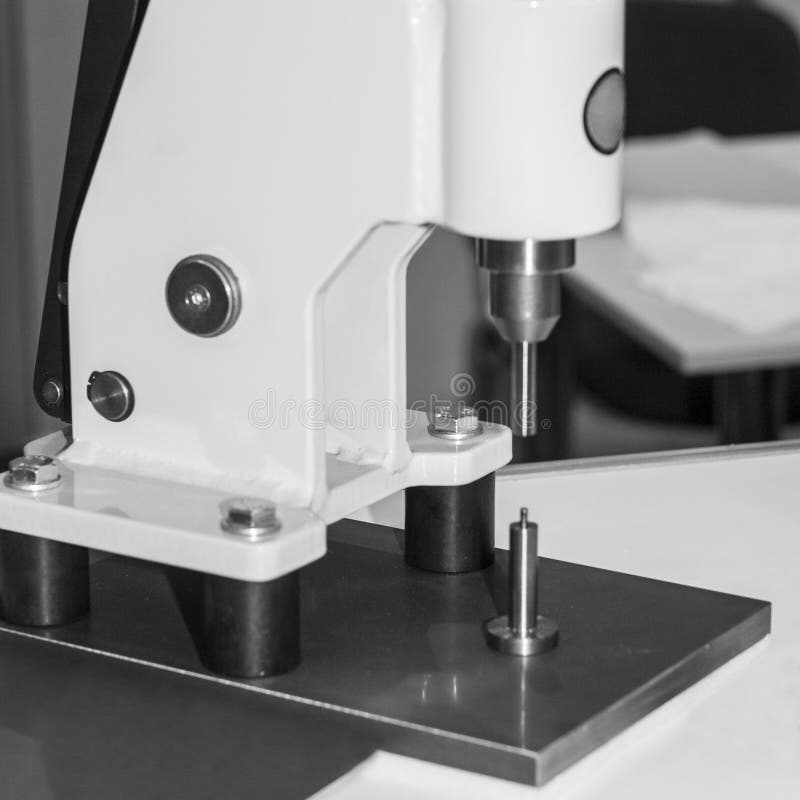 White Hand Press To Set Rivets on the Table Stock Photo - Image of dark ...