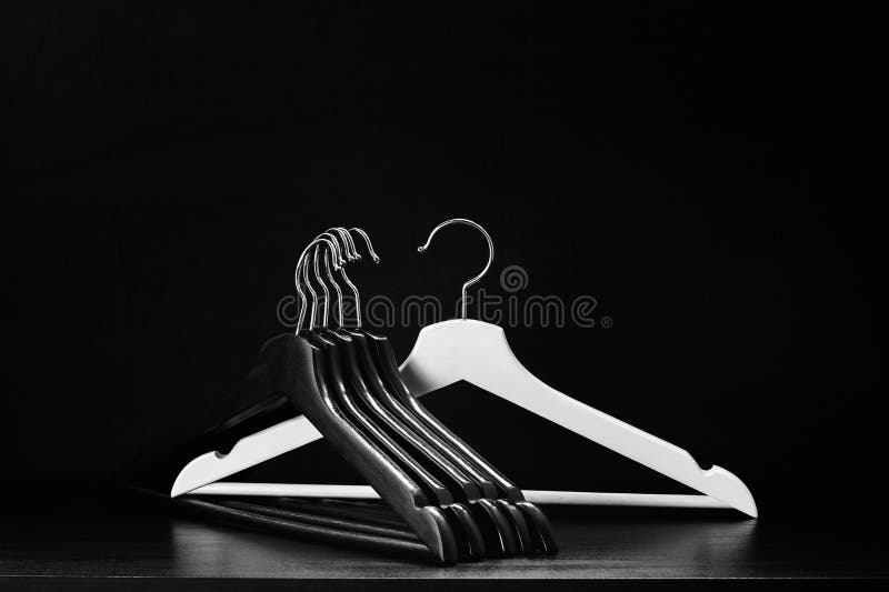 White Hanger and a Few Black Hangers, Background, Abstract Stock Photo ...