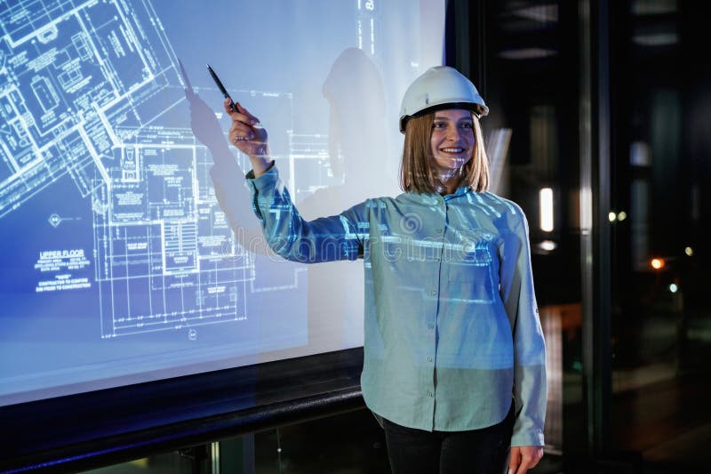In White Hard Hat. Female Architect is Showing Construction Site Plan ...