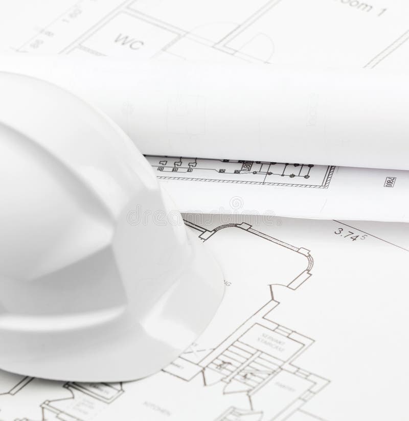 White Hard Hat Near Working Drawings Stock Image - Image of color ...