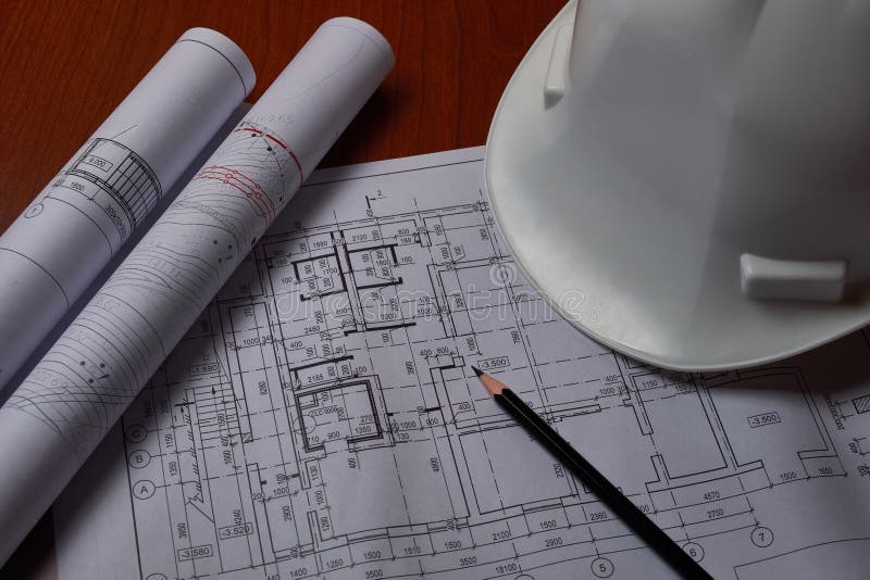 White Hardhat and Drawings at Engineer Workplace Stock Photo - Image of ...