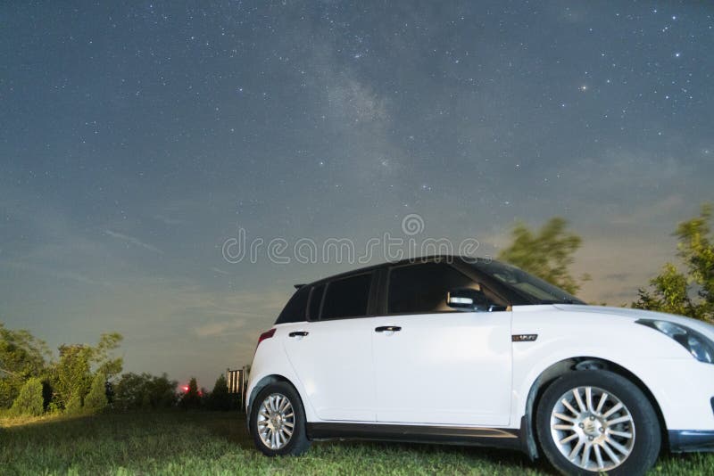 A Car Parked on the Mountaintop Under the Starry Sky and Milky Way at ...