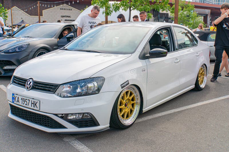 A White Hatchback Car is Parked on the Side of a Road, Showcasing ...