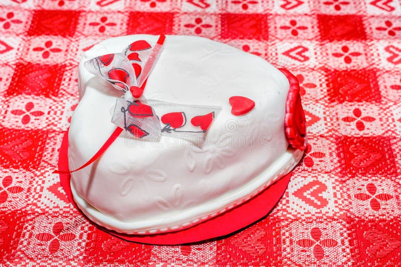 White Heart Shape Cake with Red Hearts Ribbon Stock Photo - Image of ...