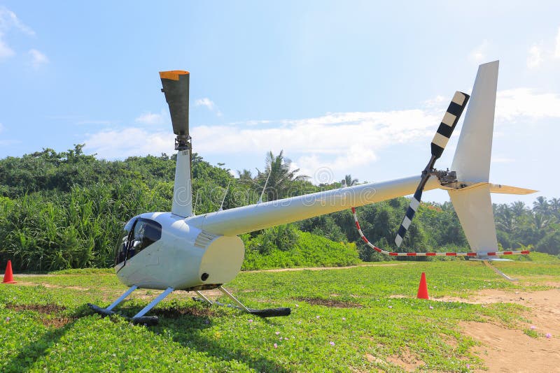 Helicopter on the beach stock photo. Image of coast - 156179364