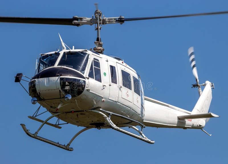 White helicopter in flight editorial stock image. Image of transport ...
