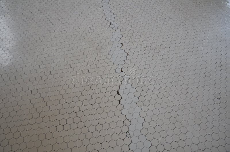White Hexagon Floor Tile with Cracks or Damage Stock Image - Image of ...