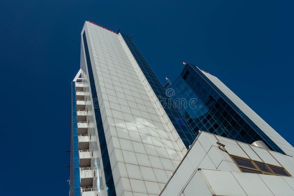 White High-rise Building Against a Blue Sky Stock Photo - Image of ...