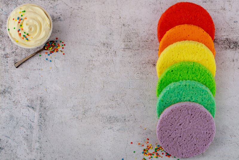 White Icing in Bowl with Round Sponge Cake Stock Image - Image of ...