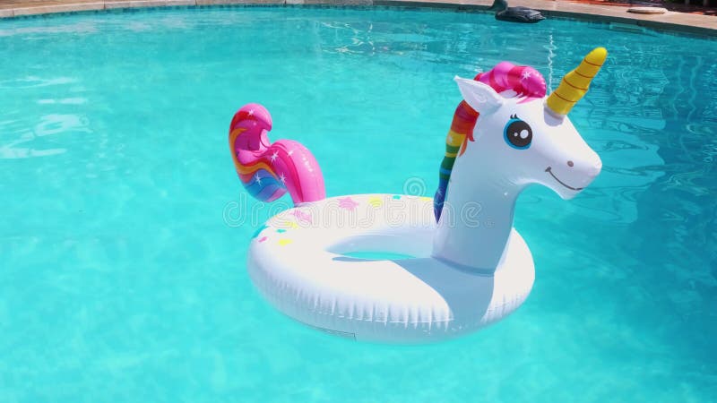 Boy Floats in Pool Lying on Stomach at Inflatable Stock Footage - Video ...