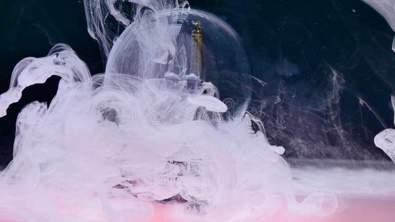 White Ink in Water with Snow Globe Background Stock Video - Video of ...