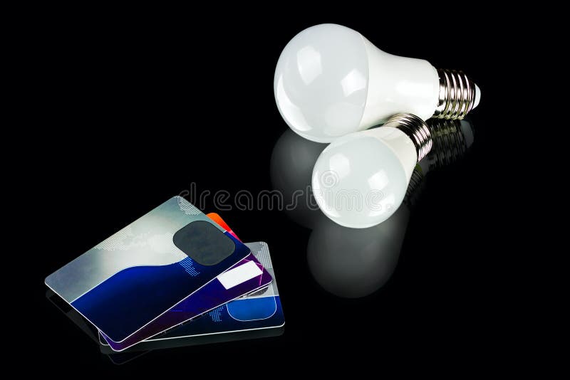 White Innovation Energy-saving LED Bulb and Credit Cards Stock Image ...