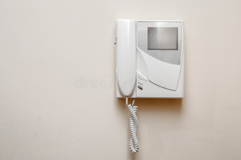 White Intercom with Screen on Beige Wall Stock Image - Image of ...