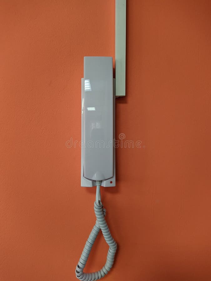 White Intercom Tube on Orange Wall Stock Photo - Image of orange ...