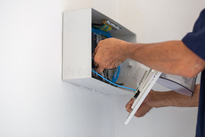 The White Iron Box is Mounted on the Wall and the Wires are Embedded ...