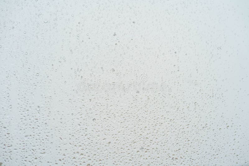 White Isolated Background Water Drops on Glass Wet Window with Splashes ...