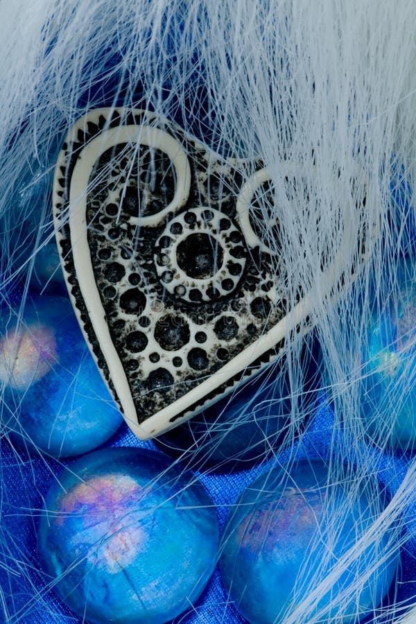 White Ivory Heart Shape on Blue Glasses Stock Image - Image of heart ...