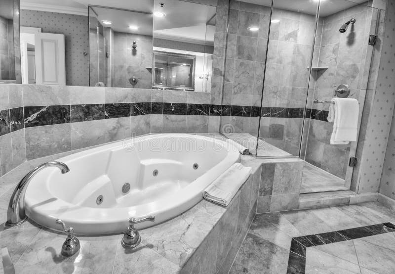 White Jacuzzi Bathtub and Brass Taps Stock Image - Image of faucet ...