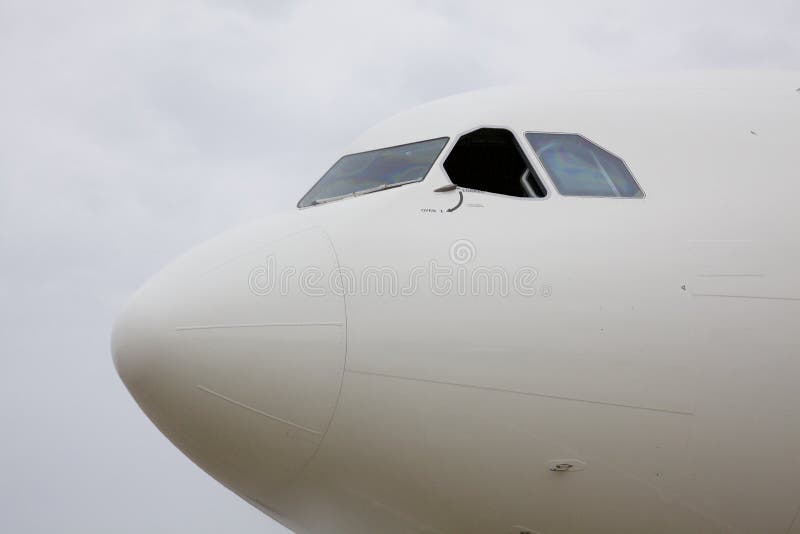 White Jet Airplane Nose with Open Cockpit Window Stock Photo - Image of ...