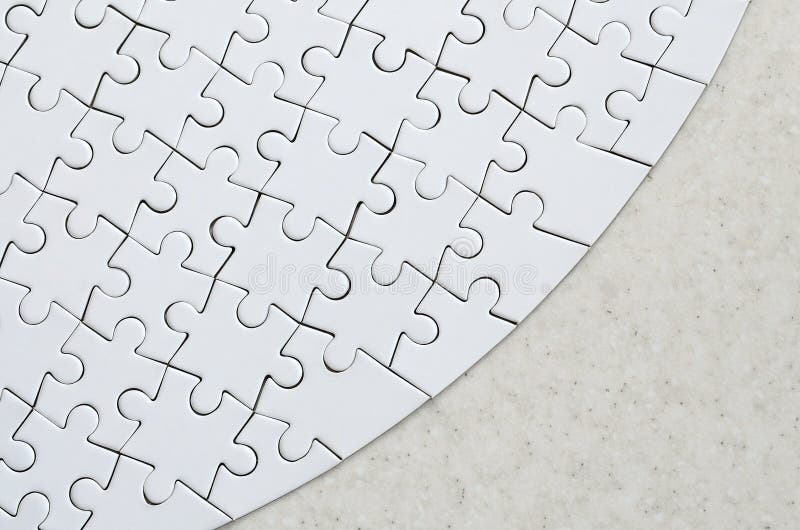A White Jigsaw Puzzle in the Complete Form Lies on a Treated Stone ...