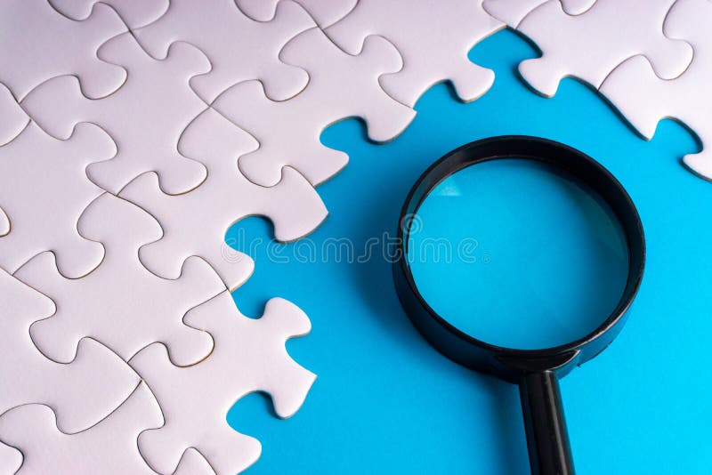 Puzzle and magnifier stock photo. Image of shape, strategies - 1461962