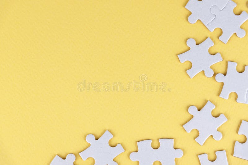 White Jigsaw Puzzle with Some Missing Pieces on Soft Yellow Background ...