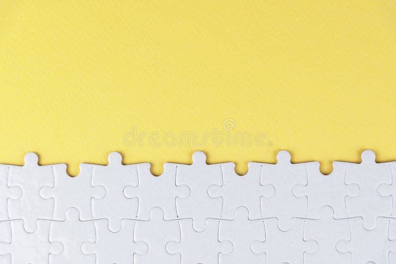White Jigsaw Puzzle with Some Missing Pieces on Soft Yellow Background ... White Jigsaw Puzzle with Some Missing Pieces on Soft Yellow Background ...