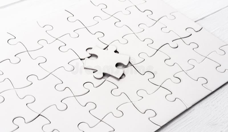 White jigsaw puzzle stock photo. Image of photograph - 240985188
