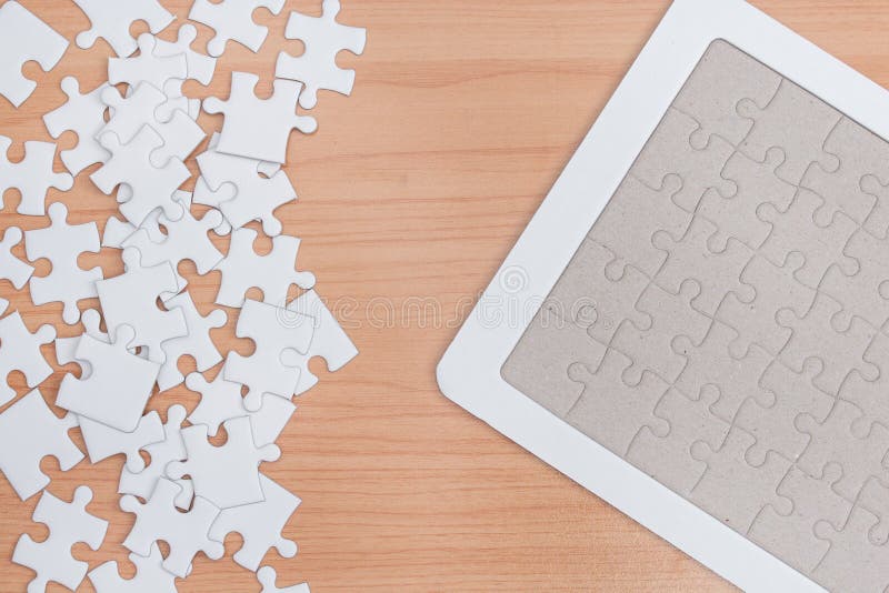 White Jigsaw Puzzle on Wood Table Stock Photo - Image of object, desk ...