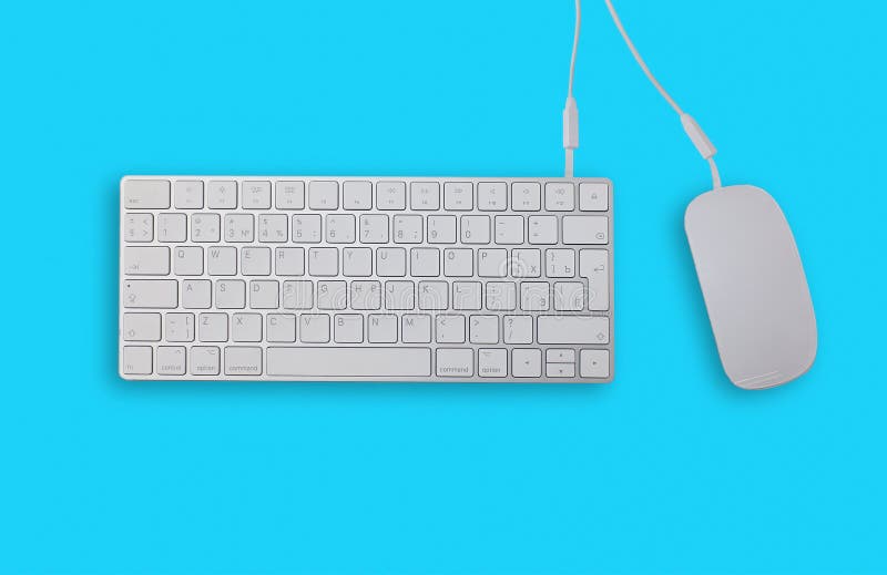 White Keyboard with a White Mouse on a Blue Background Stock Image ...