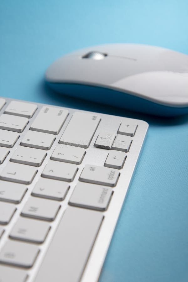 White Keyboard and Mouse on a Blue Table Stock Photo - Image of space ...
