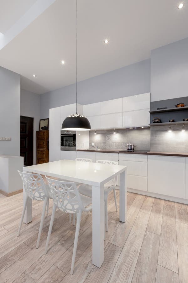 White Kitchen with Dining Table Stock Image - Image of apartment ...