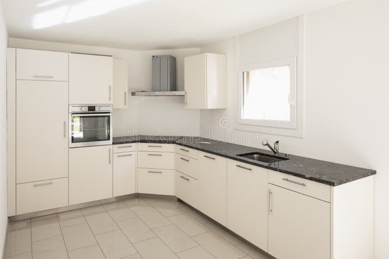 White Kitchen in Empty Apartment Stock Photo - Image of stove, space ...