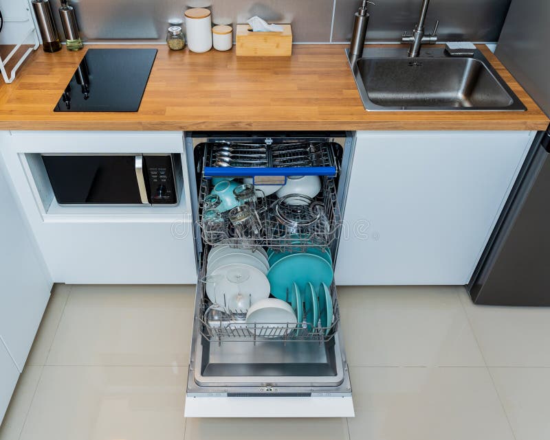 The White Kitchen and Opened Dishwasher with Clean Dishes Stock Photo ...