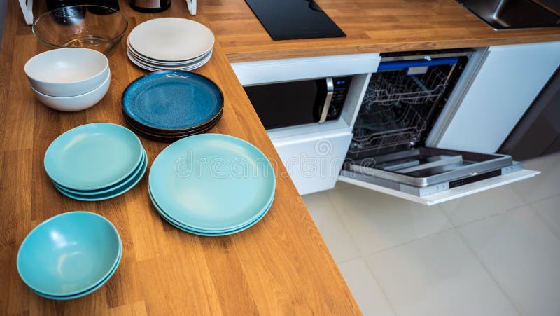 The White Kitchen and Opened Dishwasher with Clean Dishes Stock Image ...