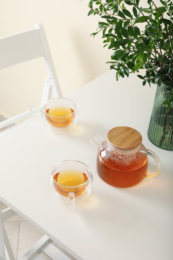White Kitchen Table with Tea and Plant Stock Photo - Image of drink ...