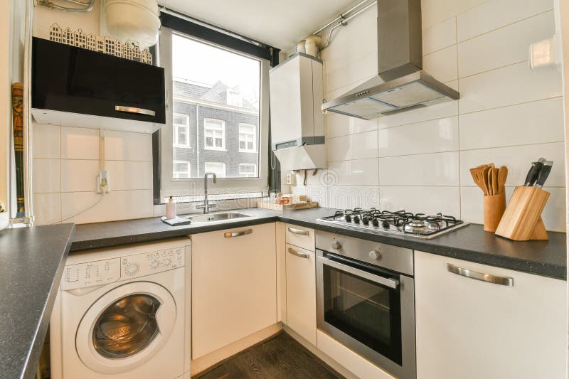 A Kitchen with a Washing Machine and a Dryer Stock Photo - Image of ...