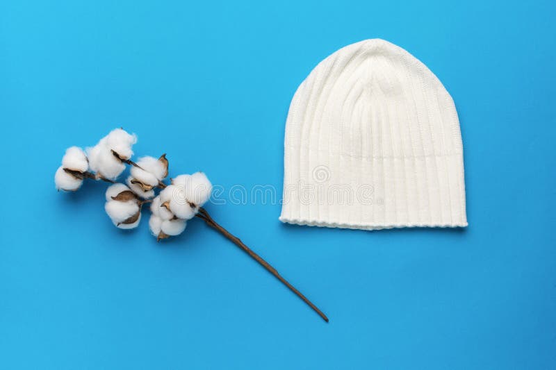 White Knitted Cotton Hat on a Blue Background Stock Photo - Image of ...