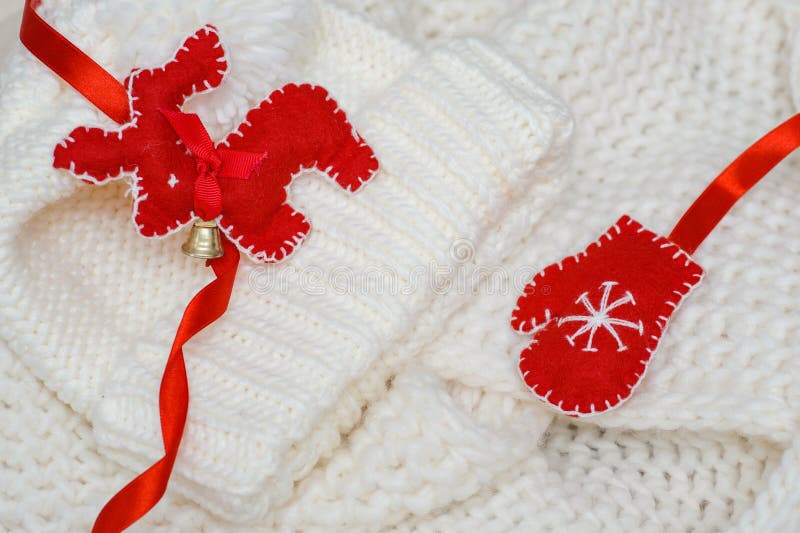 White Knitted Hat and Red Toys Stock Photo - Image of knitted ...