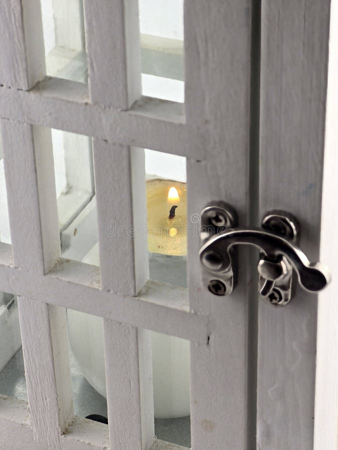 A White Lantern,lamp with a Candle Burning Inside. Stock Image - Image ...