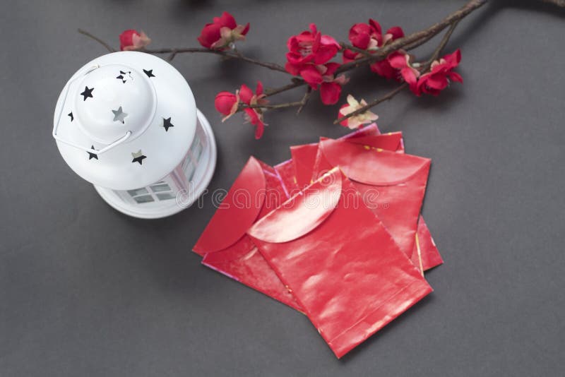 White Lantern Light with Red Envelopes and Flowers Branch on Dark Gray ...